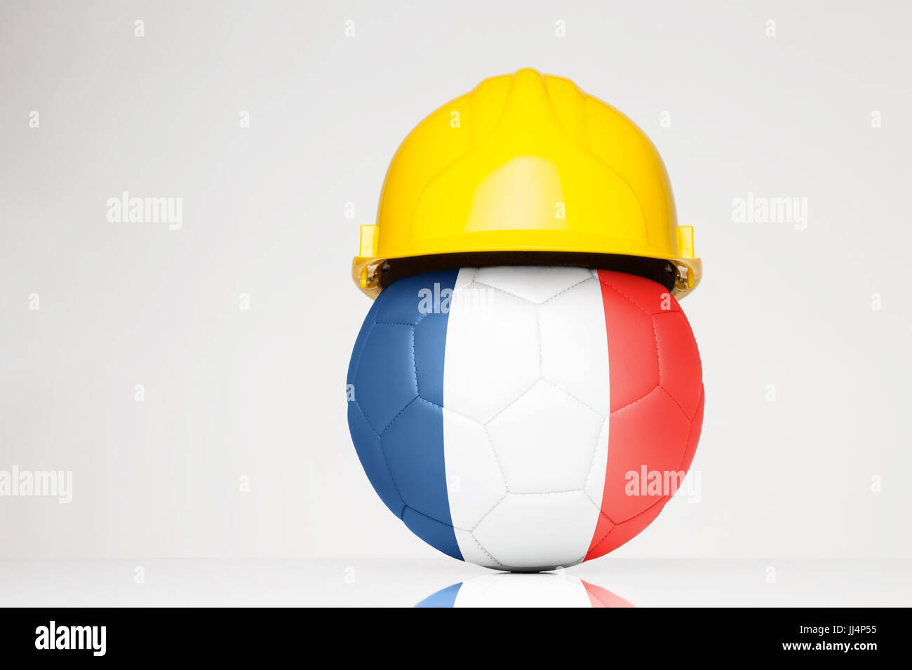 Football wearing a hard hat with the France flag superimposed on the ...