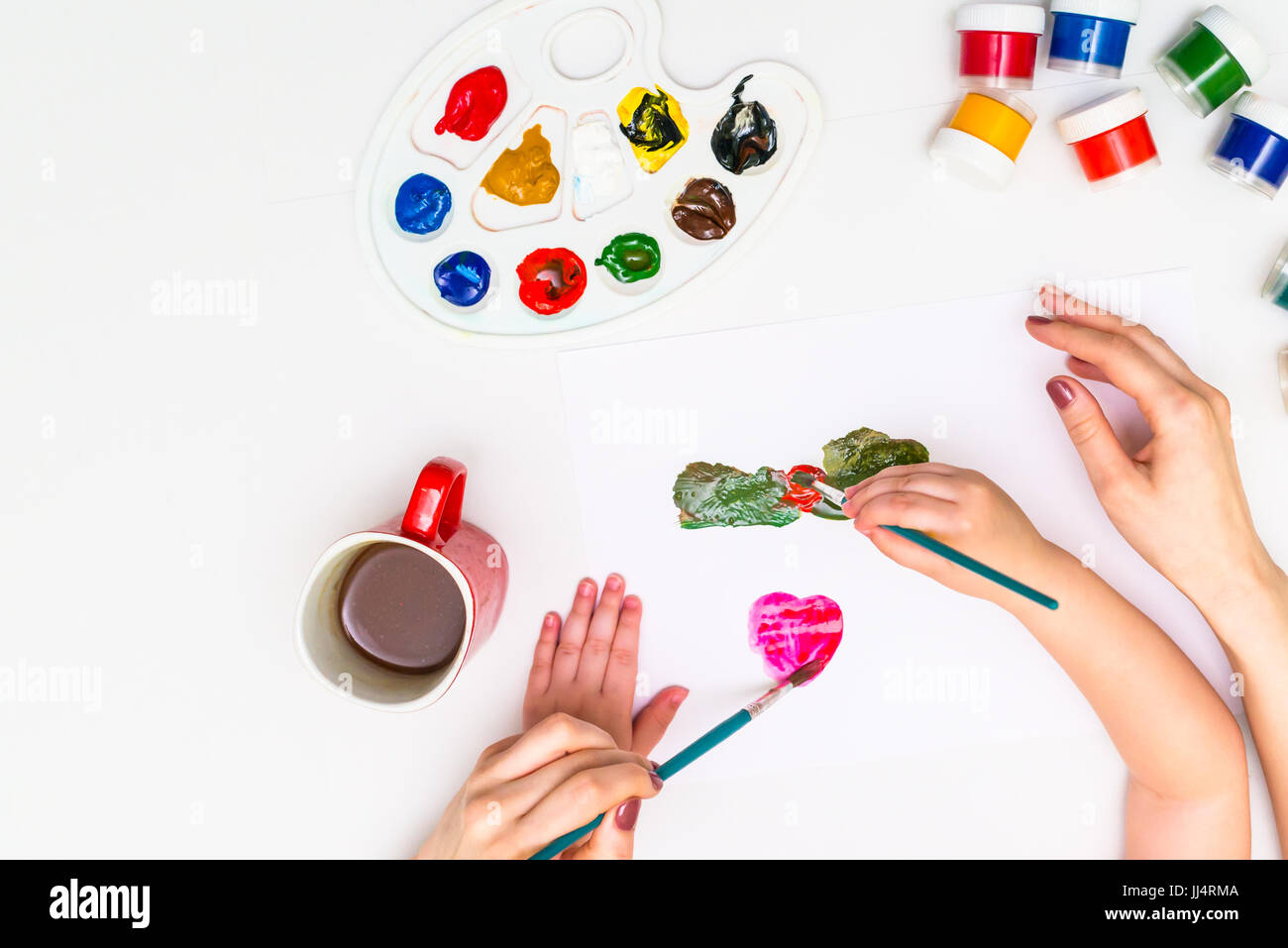 Child's hands painting a flower Stock Photo - Alamy