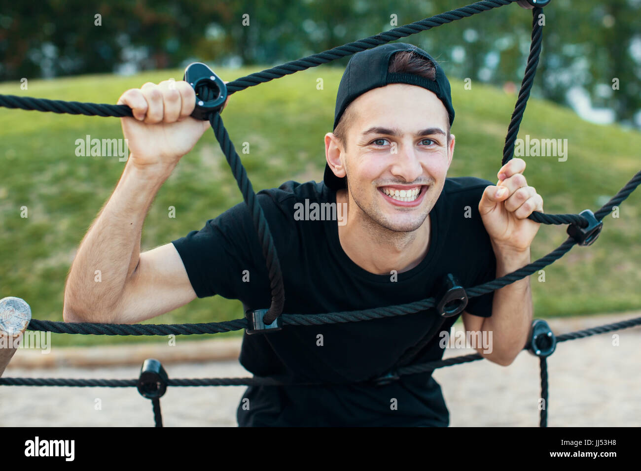 Portrait of a gorgeous young fun guy outdoors Stock Photo - Alamy