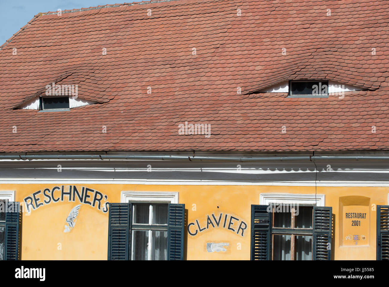 Eye-shaped windows on the tiled roofs of Sibiu, Transylvania, Romania ...