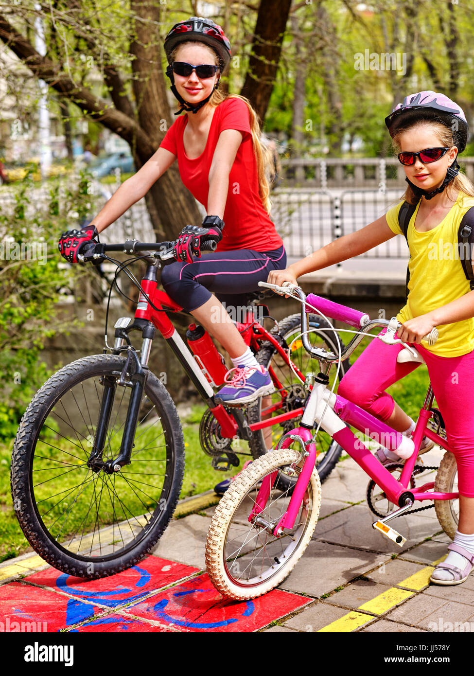 Family bike ride with rucksack cycling on bike lane Stock Photo - Alamy