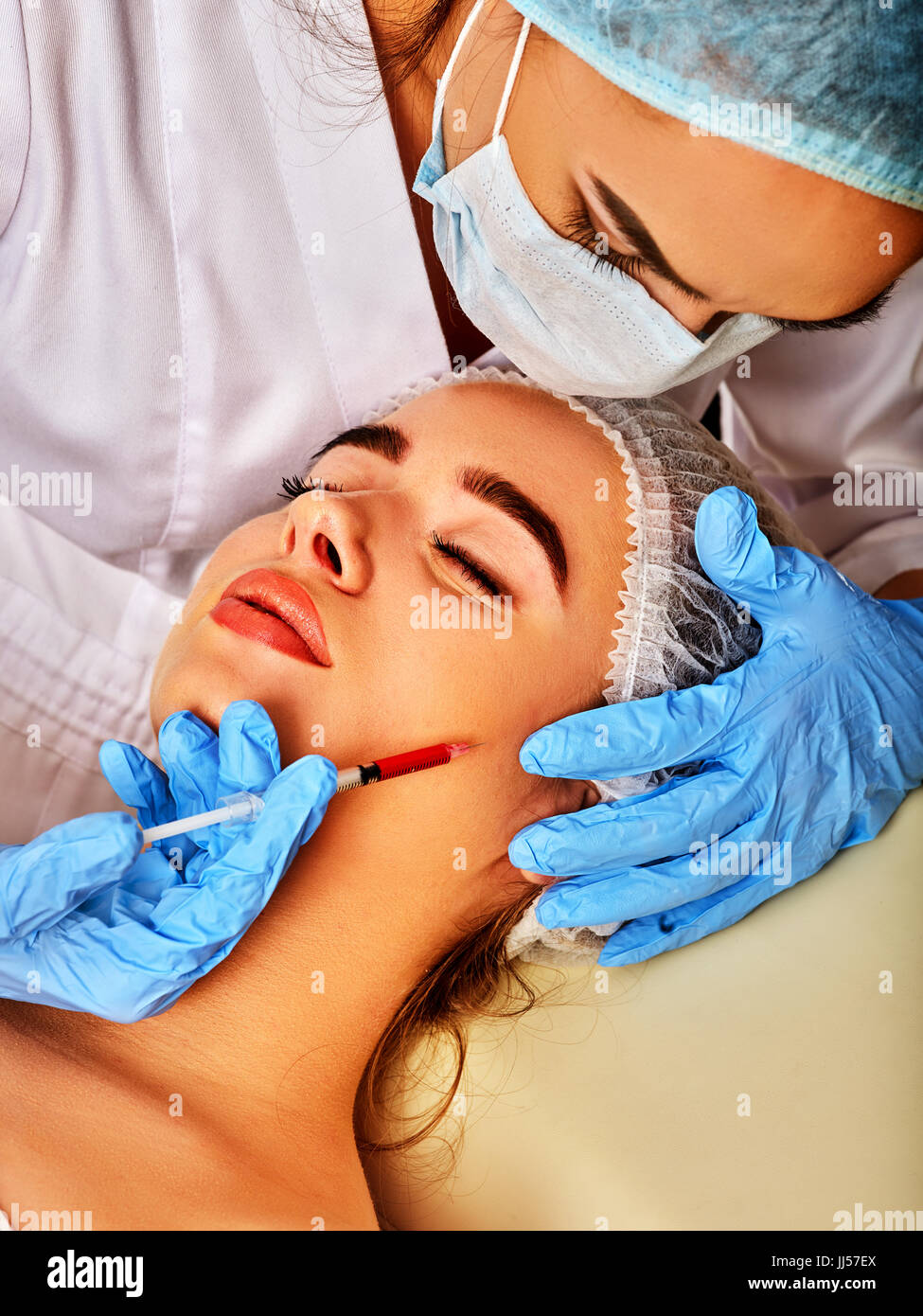 Dermal fillers of woman in spa salon with beautician Stock Photo - Alamy