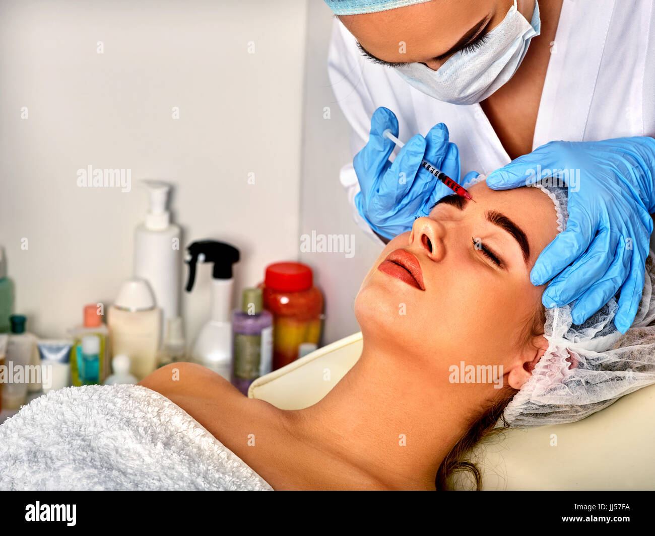 Dermal fillers of woman in spa salon with beautician Stock Photo - Alamy