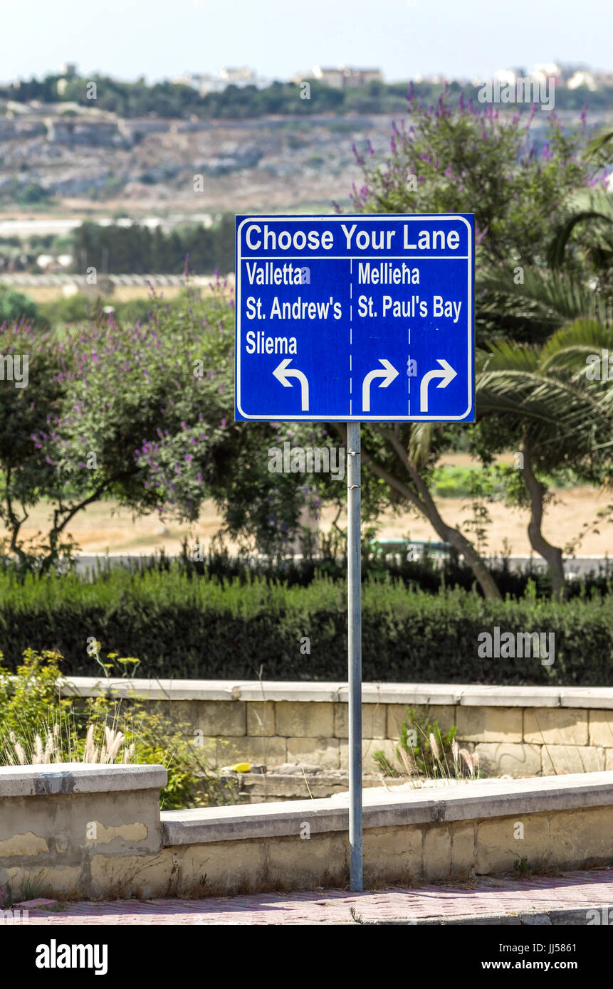 Malta, Bugibba: Blue road sign showing the way to some popular tourist ...