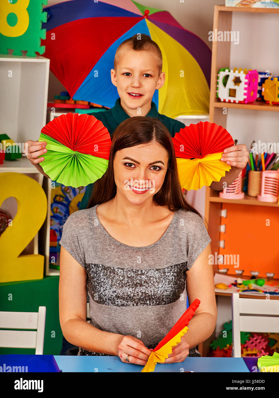 School children with scissors in kids hands cutting paper Stock Photo ...