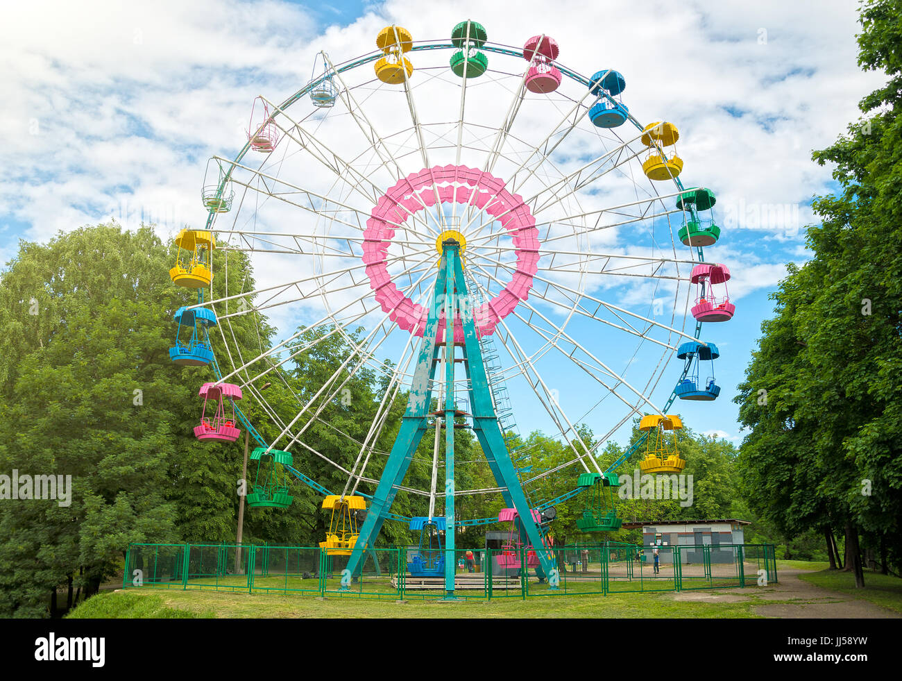 Colorful ferris wheel in the city park Stock Photo - Alamy