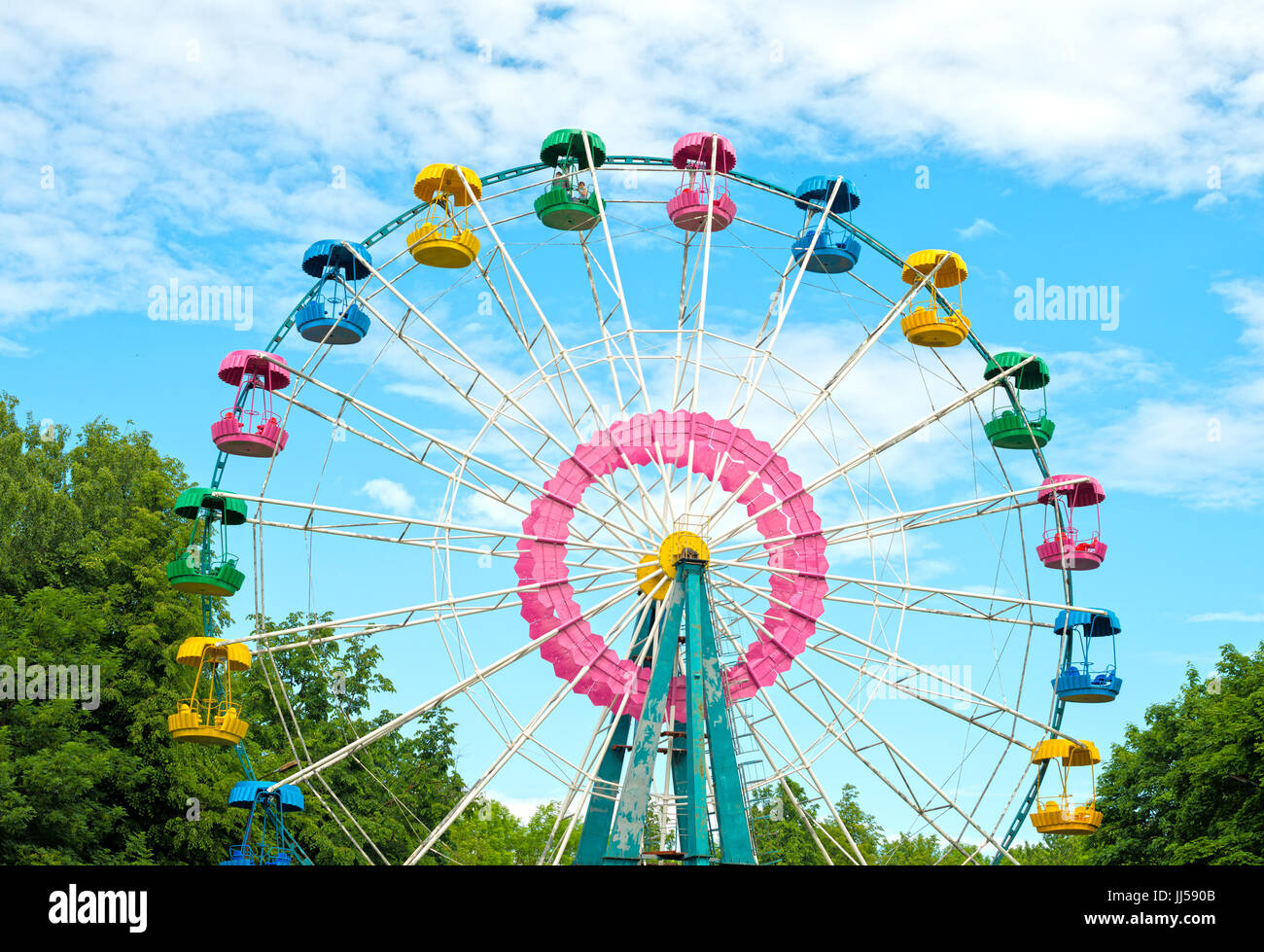 Colorful ferris wheel in the city park Stock Photo - Alamy