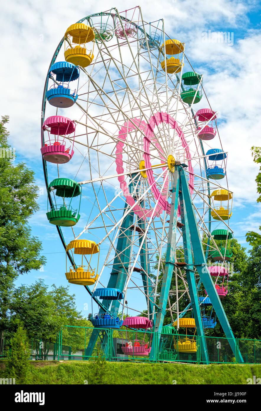 Colorful ferris wheel in the city park Stock Photo - Alamy