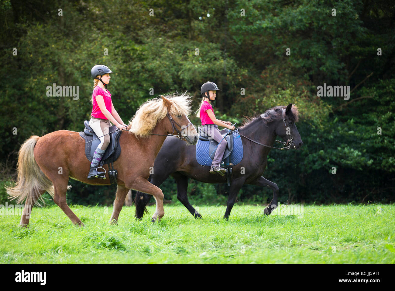 Two children horse riding hi-res stock photography and images - Alamy