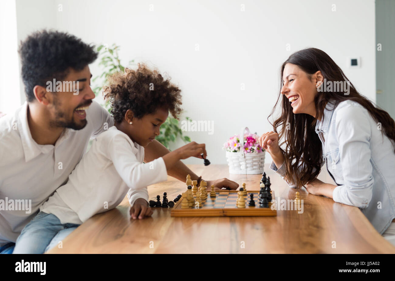 Family play game chess hi-res stock photography and images - Alamy