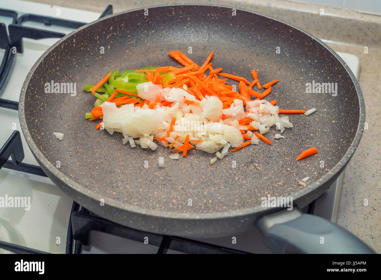 Chopped vegetables on frying pan healthy food Stock Photo - Alamy