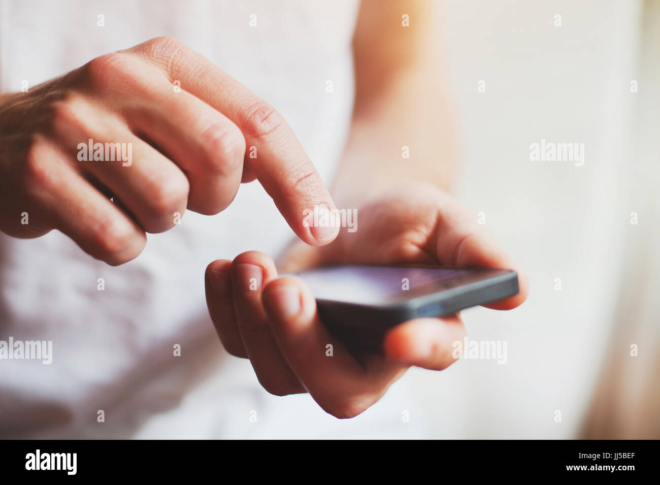 person using mobile application on smartphone, abstract close up of ...