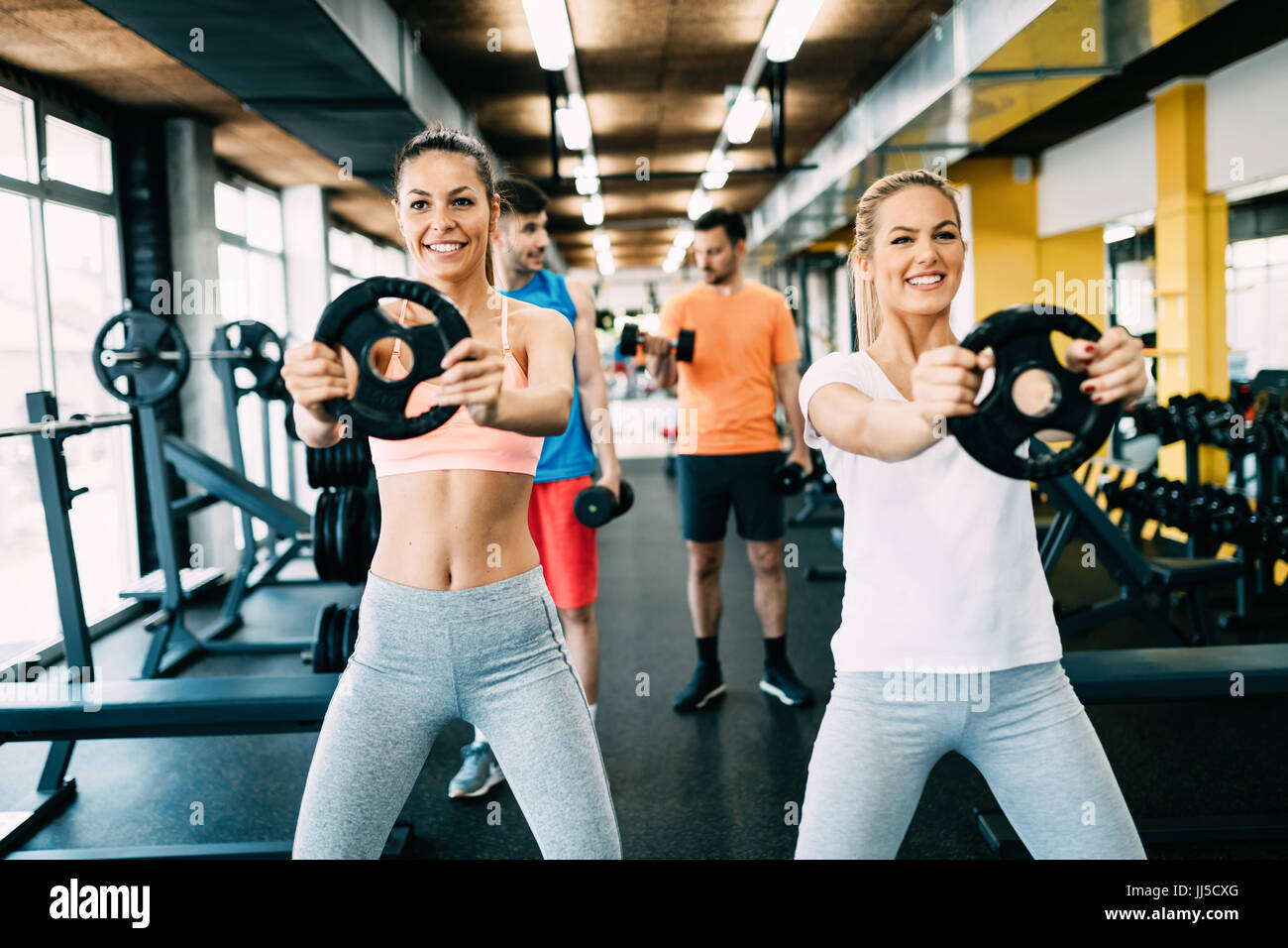 Beautiful women working out in gym together Stock Photo - Alamy