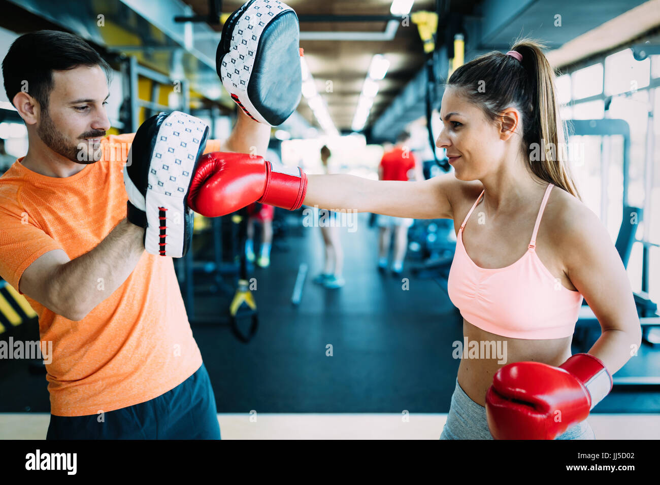 Picture of woman boxing with her trainer Stock Photo - Alamy
