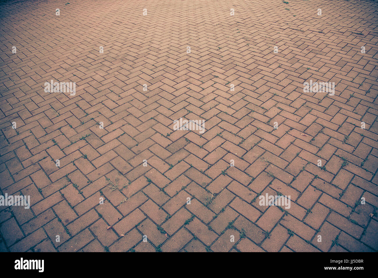 Ancient red brick footpath background walk way. vintage tone with ...