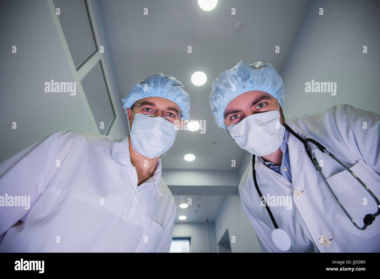 Surgeons standing above of the patient before surgery Stock Photo - Alamy