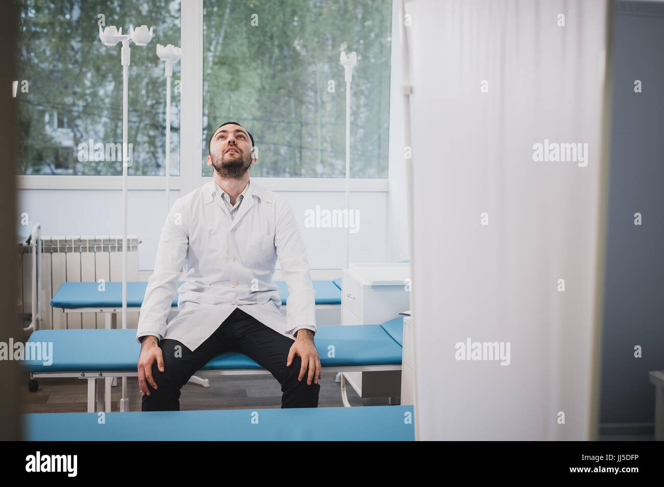 Sad people hospital hallway hi-res stock photography and images - Alamy