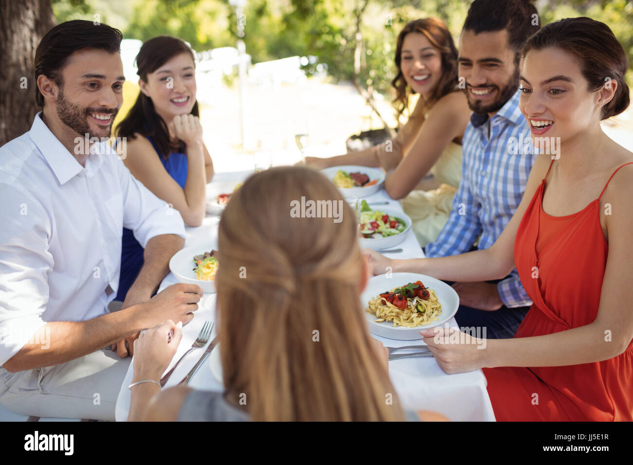 Group of friends having lunch in a restaurant Stock Photo - Alamy