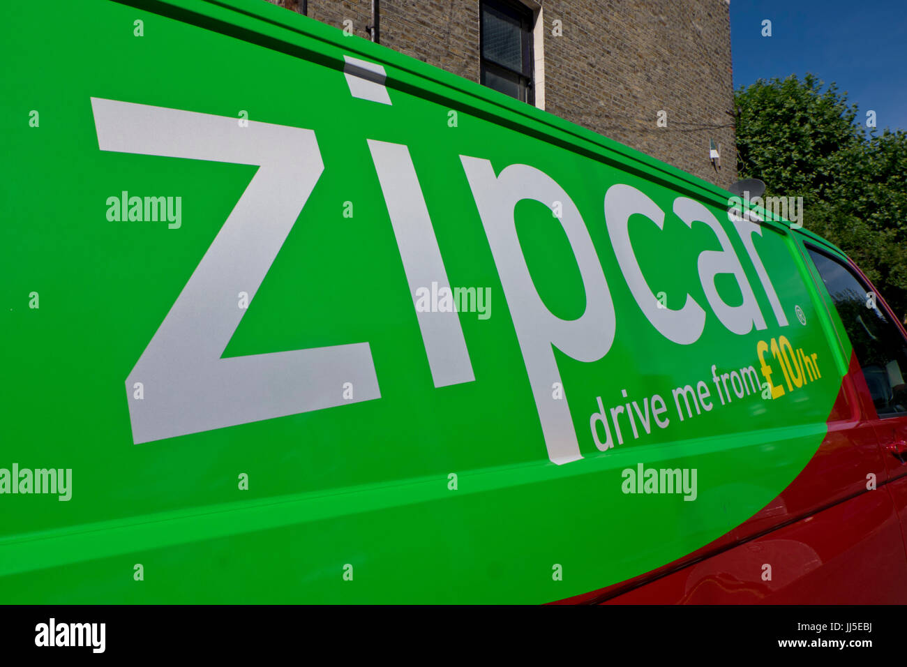 Zipcar car club bay and sign in a street in London,UK. Customers can ...