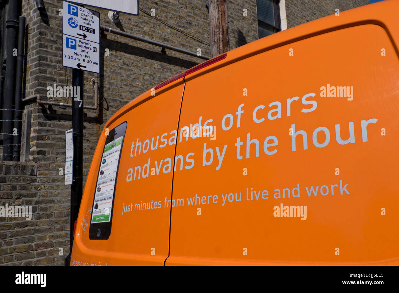 Zipcar car club bay and sign in a street in London,UK. Customers can ...