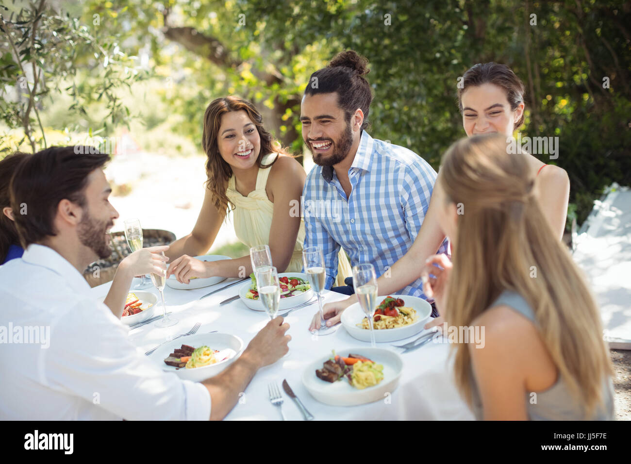 Group of friends having lunch in a restaurant Stock Photo - Alamy