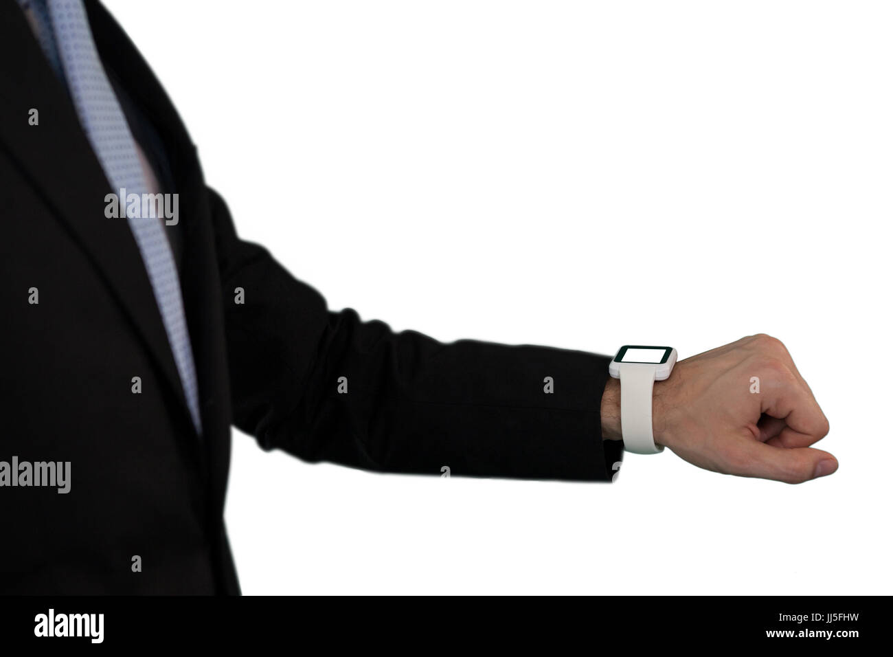 Side view of businessman wearing smart watch against white background ...
