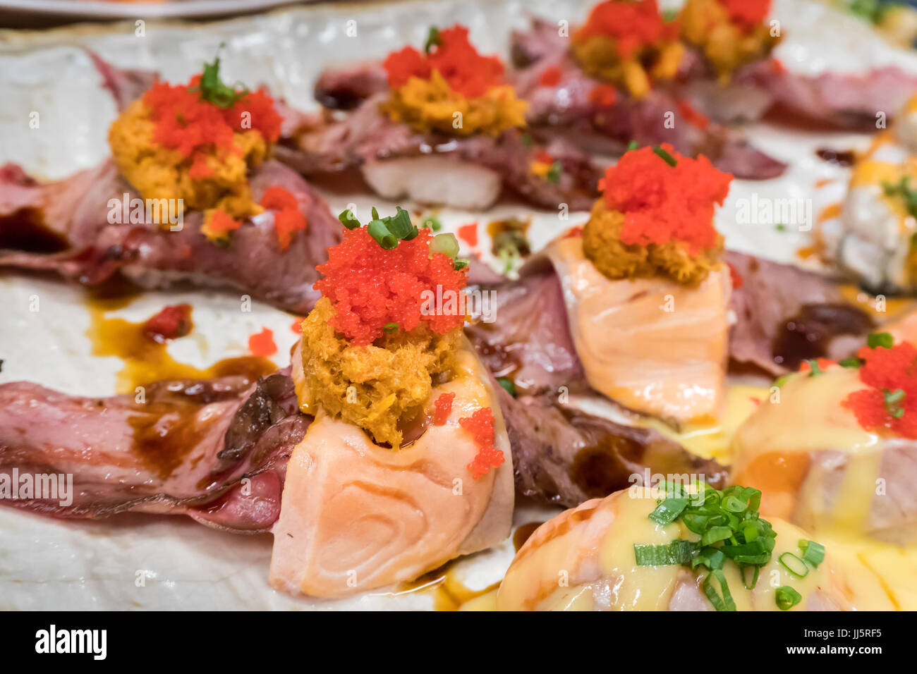 sliced beef sushi with sauce - japanese food style Stock Photo - Alamy