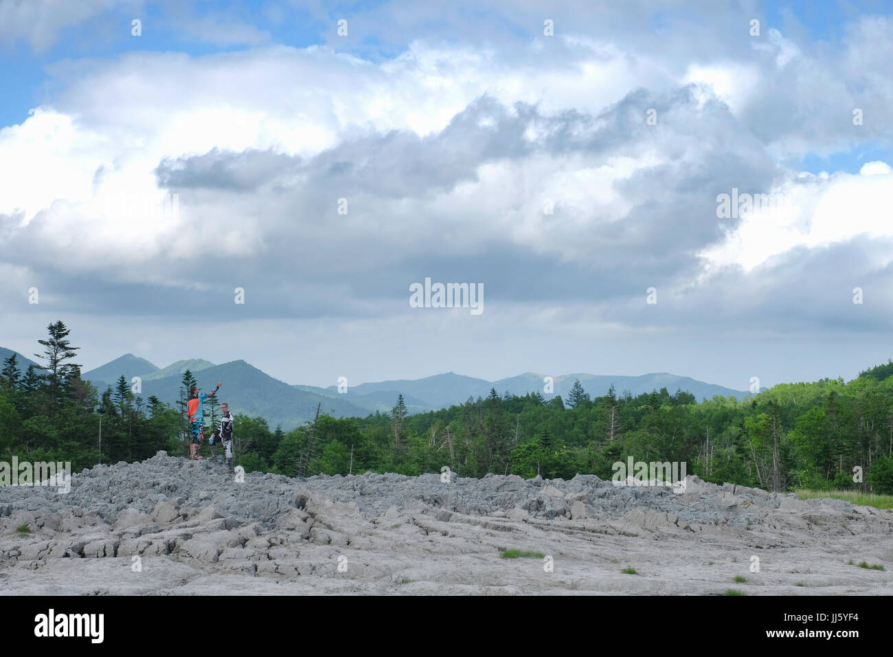 Russian motorcyclists stand over the dry mud volcano located in the ...