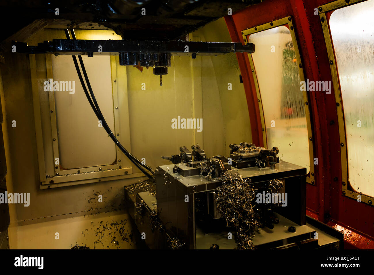 Inside CNC machining Center machine cutting part in Jig with coolant ...