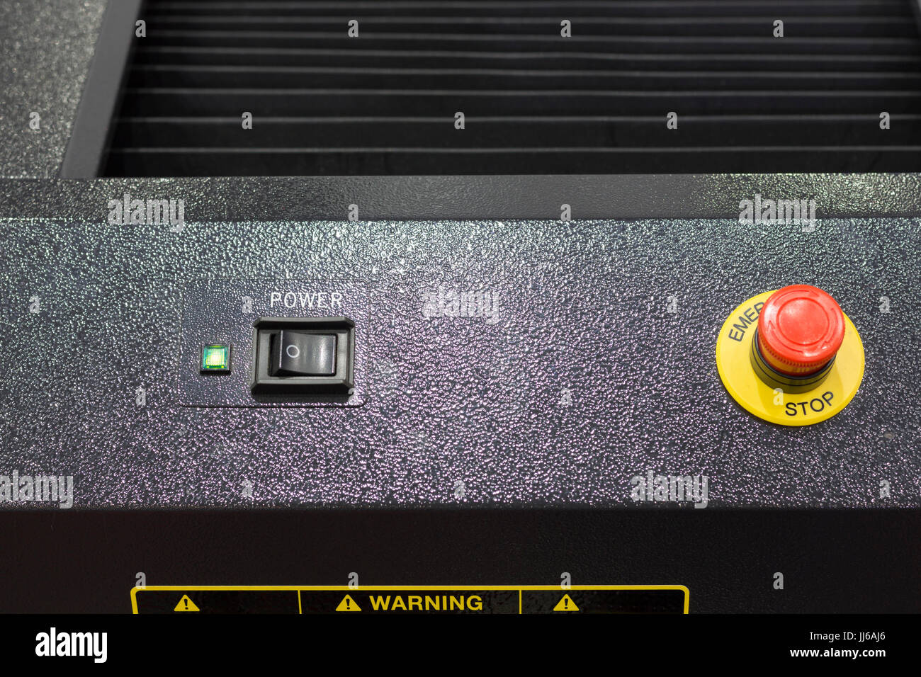 On/Off Switch and emergency stop button in black equipment ;Security ...