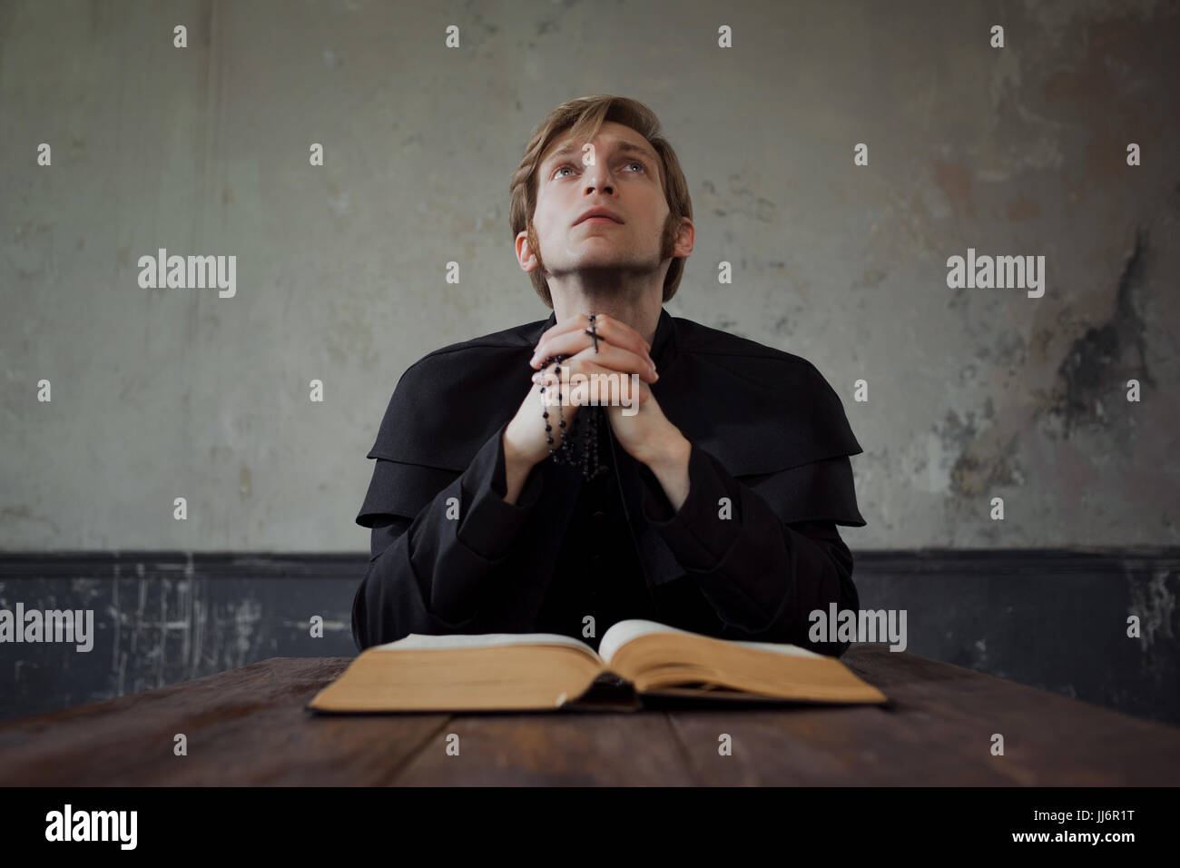 Praying priest hi-res stock photography and images - Alamy
