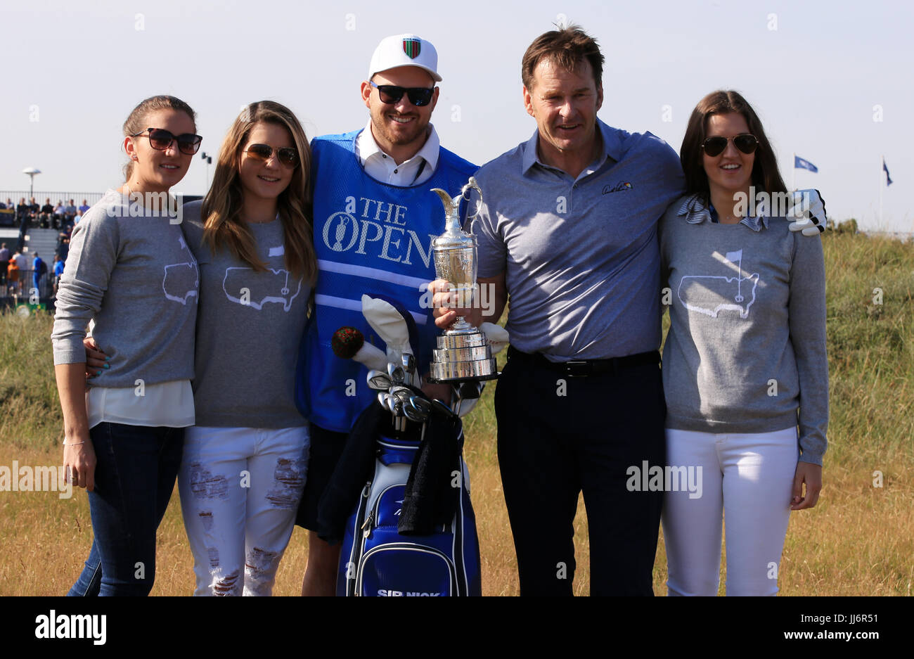 Sir Nick Faldo poses with the Claret Jug and members of his family ...
