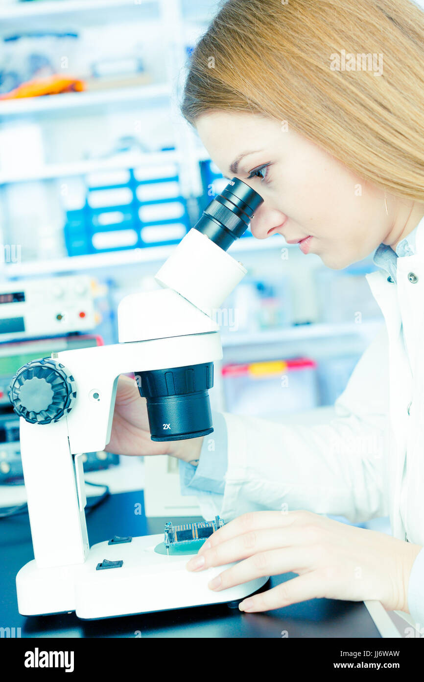 woman with microscope in microelectronics laboratory Stock Photo - Alamy