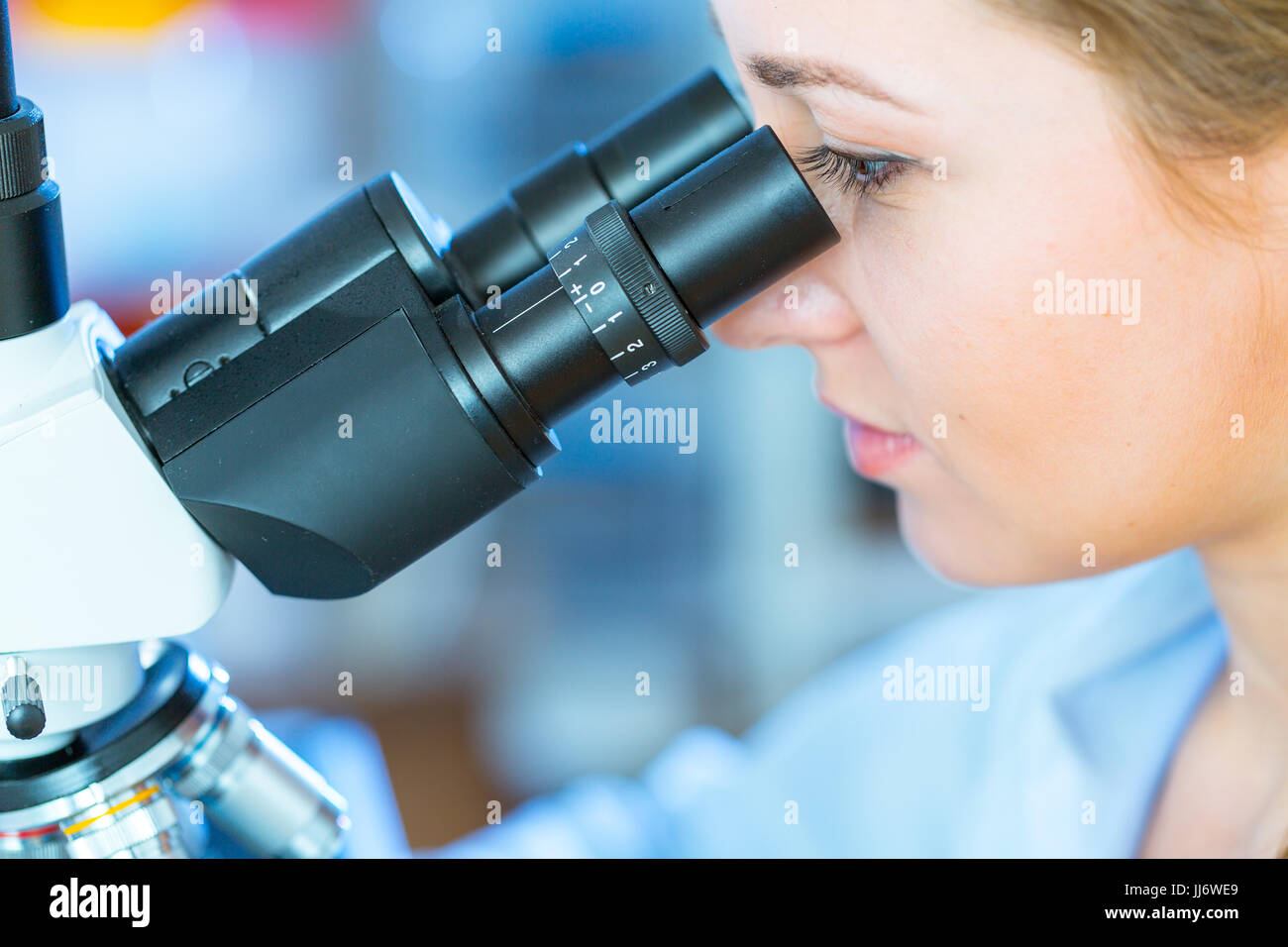 woman with microscope in microelectronics laboratory Stock Photo - Alamy