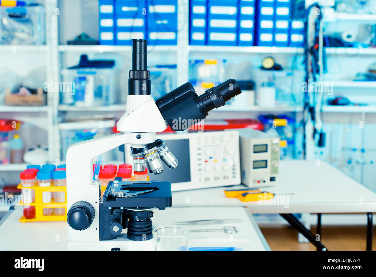 Microscope in laboratory interior Stock Photo - Alamy