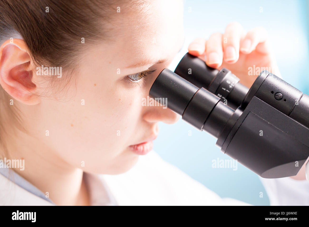 Women work in laboratory with microscope Stock Photo - Alamy