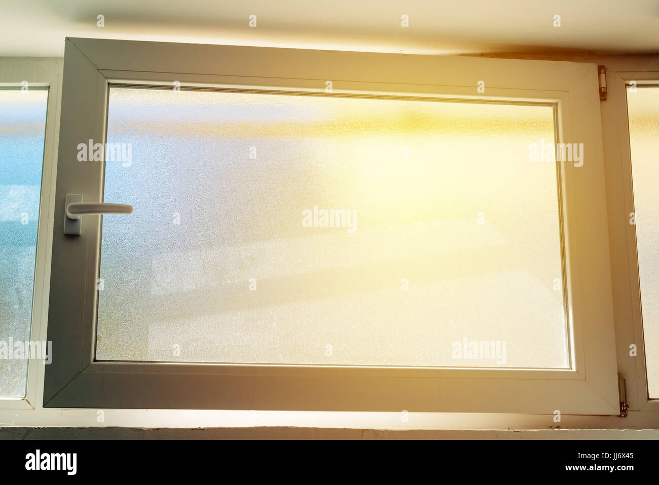 Open PVC basement window with sunlight shining in Stock Photo - Alamy