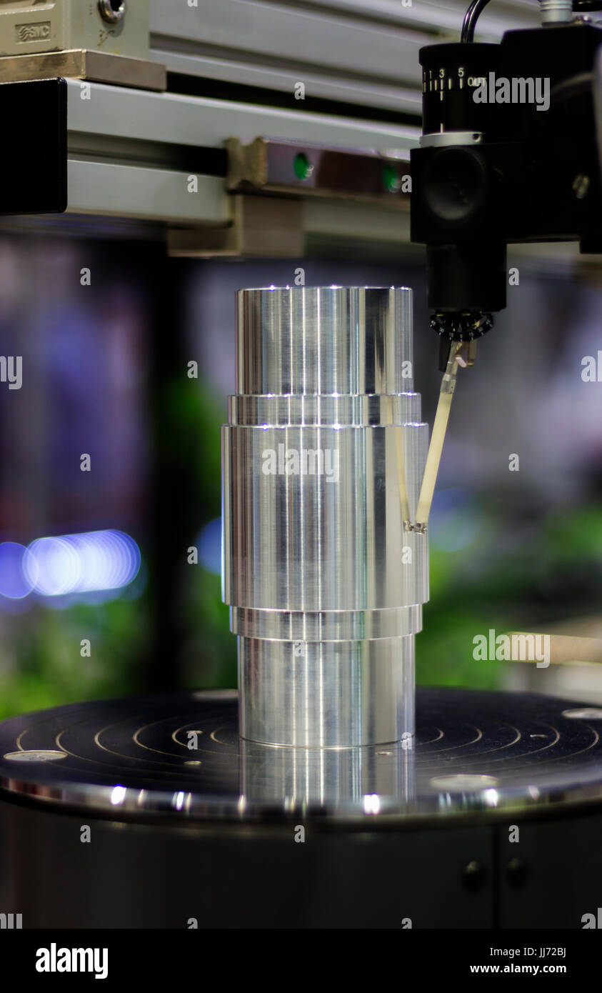Roundness tester measuring workpiece on turntable ;focus in stylus ...