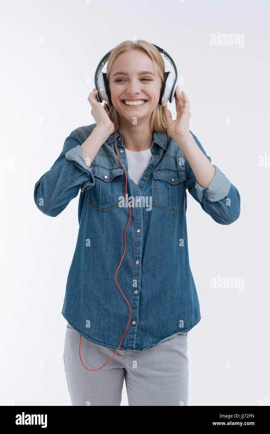 Portrait of smiling female that enjoying music Stock Photo - Alamy