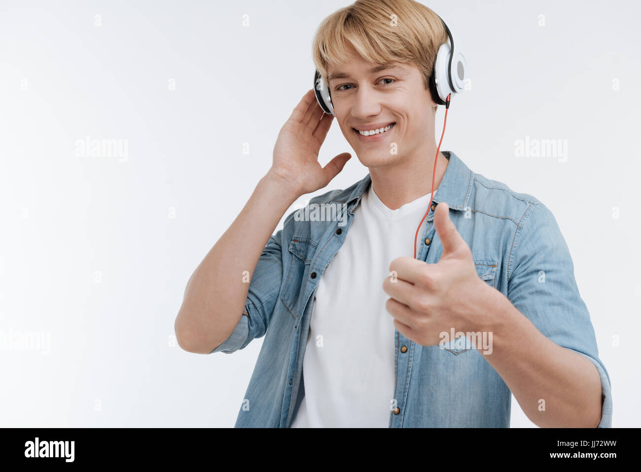 Handsome male person showing that that he is satisfied Stock Photo - Alamy