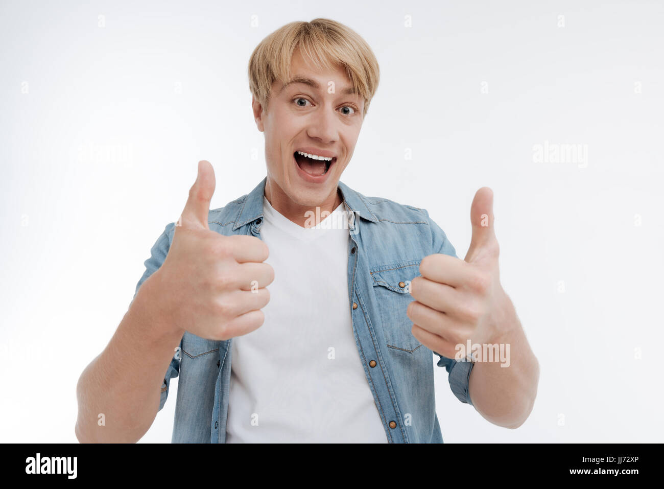Positive delighted male person being very glad Stock Photo - Alamy