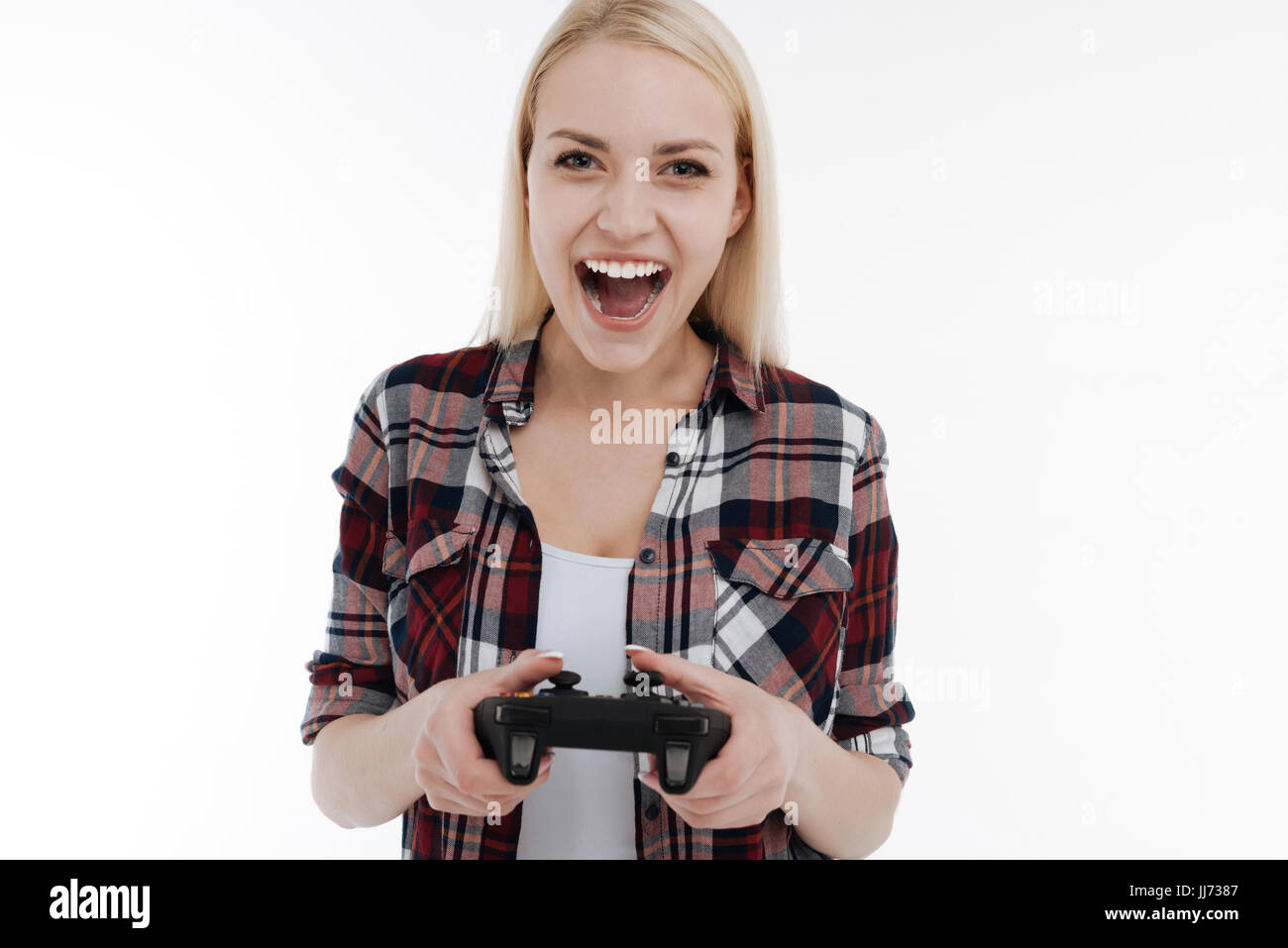 Funny girl playing with game console Stock Photo - Alamy