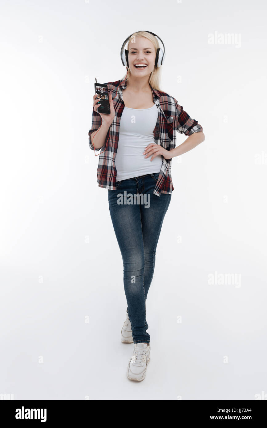 Charming woman putting left arm on the waist Stock Photo - Alamy