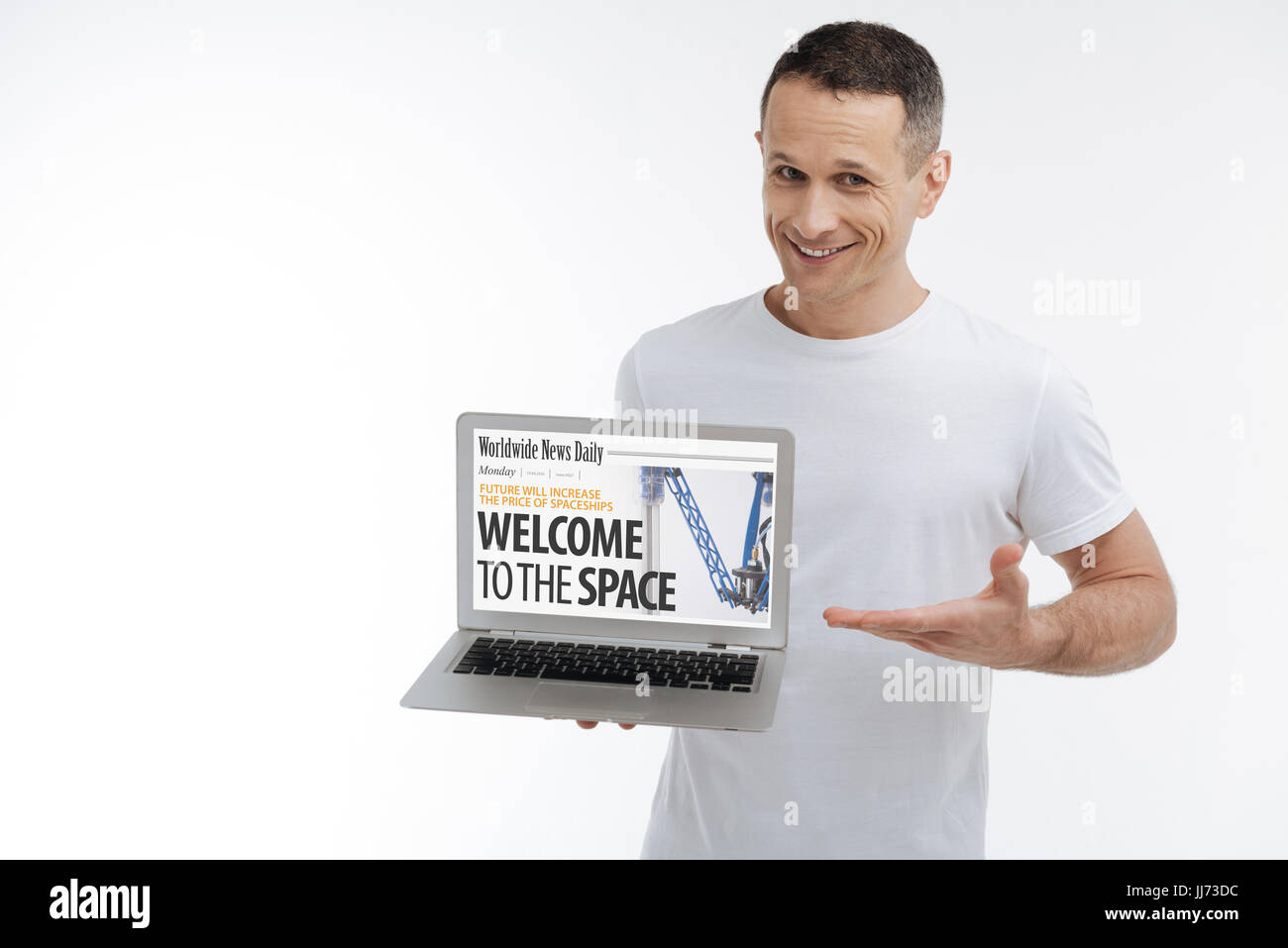 Handsome male demonstrating his website Stock Photo - Alamy