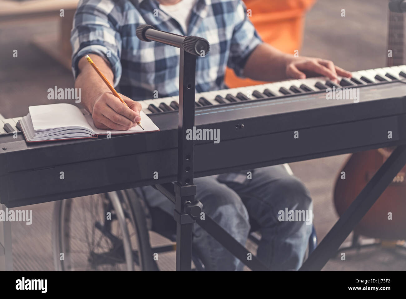 Close up of musician making some notes Stock Photo - Alamy