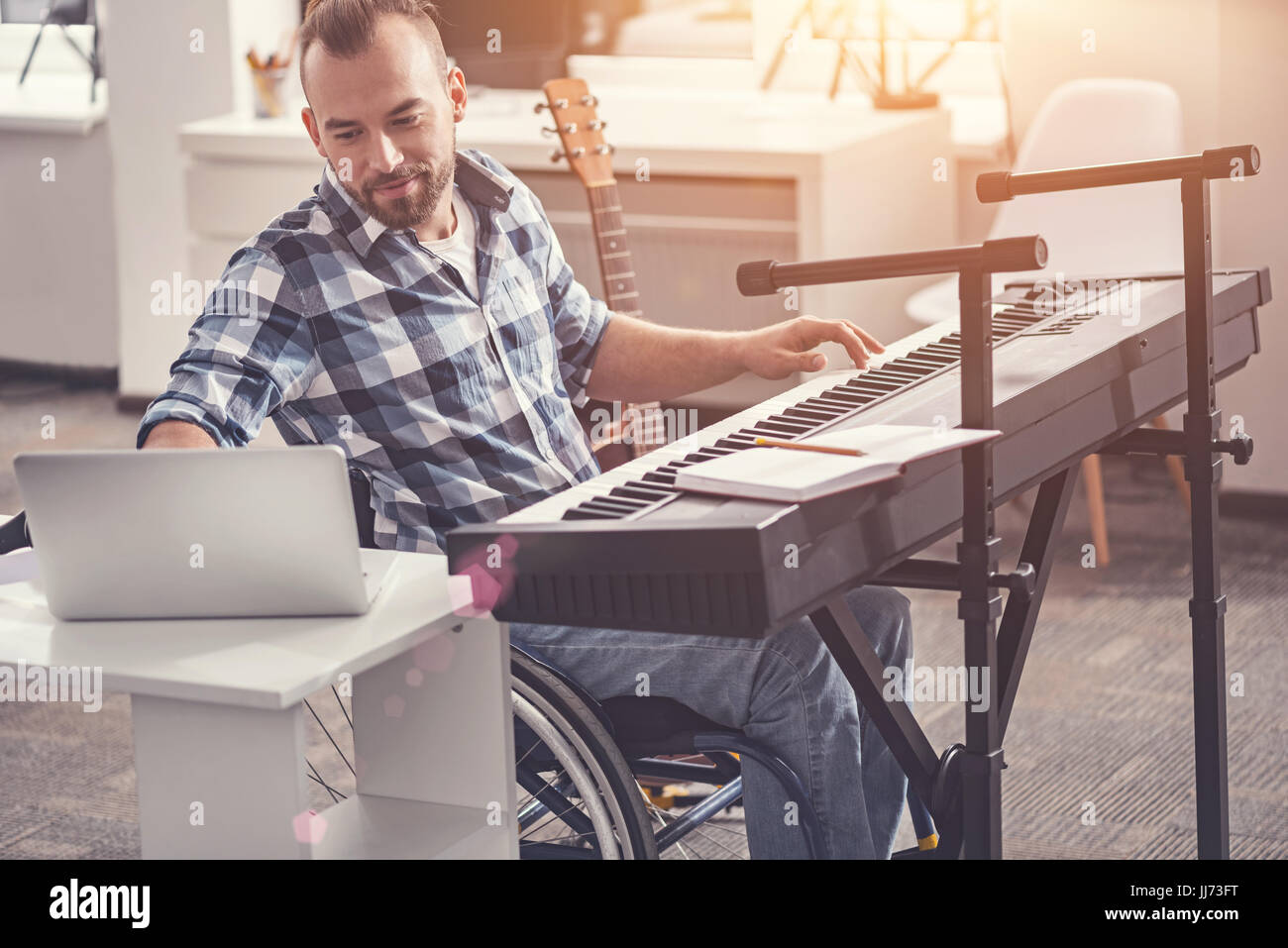 Handsome creative personality looking at his computer Stock Photo - Alamy