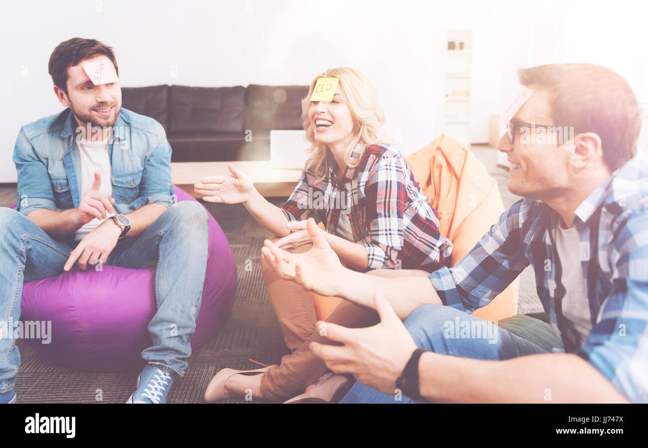 Positive colleagues playing games in the office Stock Photo - Alamy