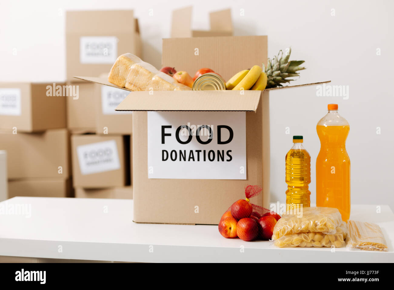 Light grey box being filled with foods Stock Photo - Alamy