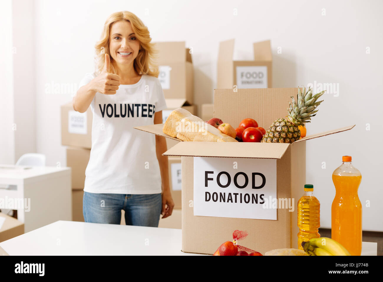 Woman collecting a parcel hi-res stock photography and images - Alamy