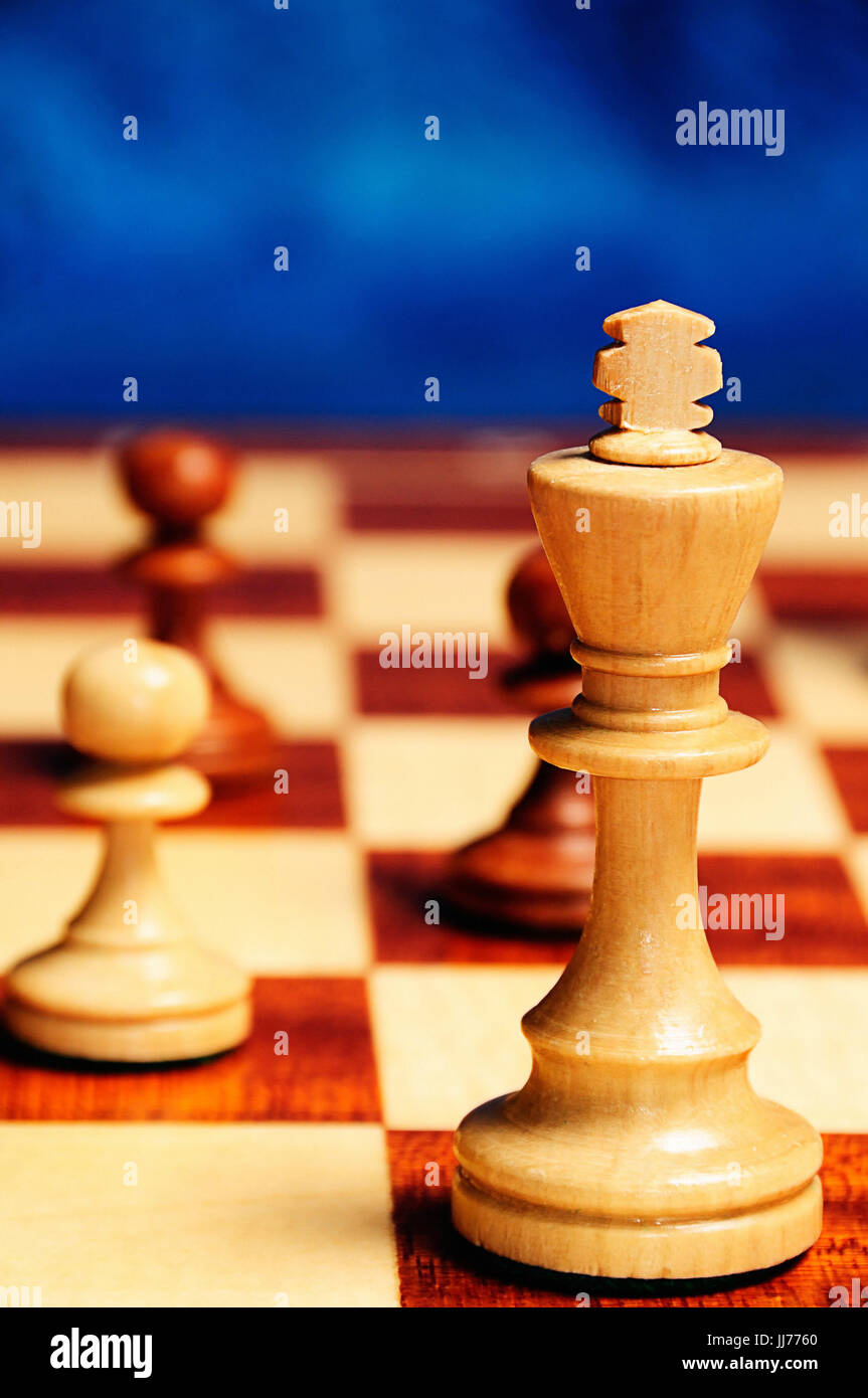 chess king and pawns on the chessboard Stock Photo - Alamy